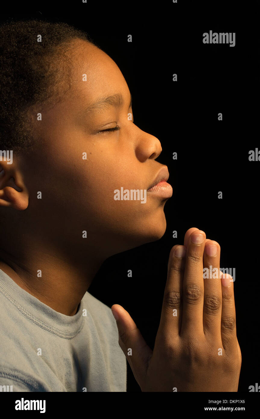 A boy prays to God Stock Photo - Alamy