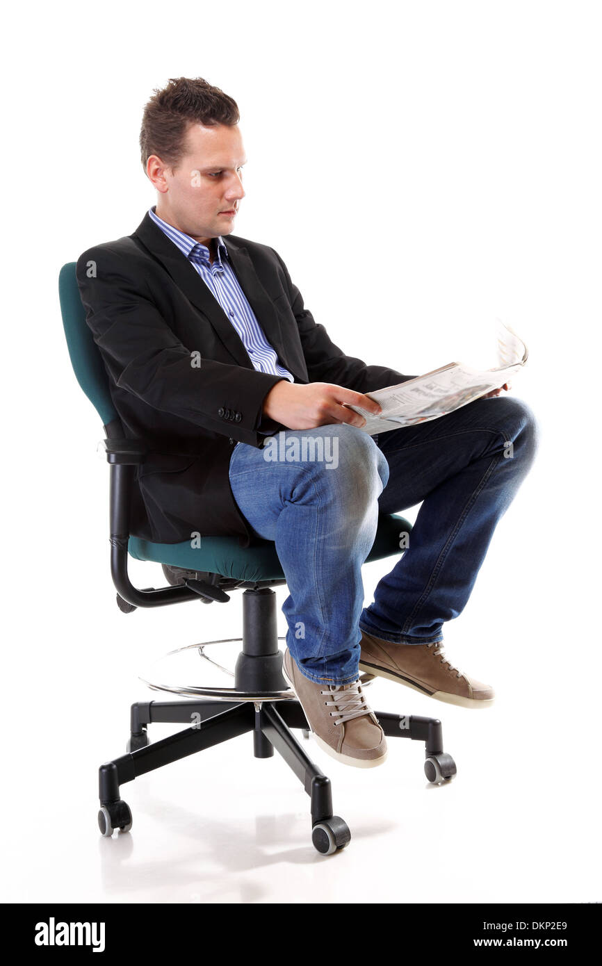 Full length businessman sitting on chair reading a newspaper isolated ...