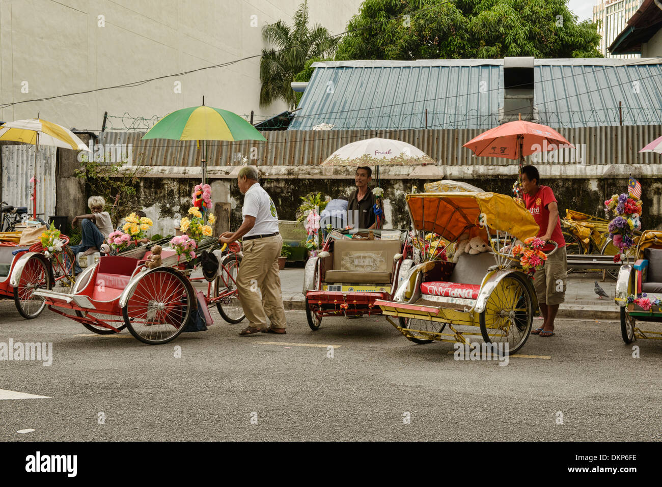 becak (trishaw) drivers, symbol of Georgetown in Penang, Malaysia Stock ...