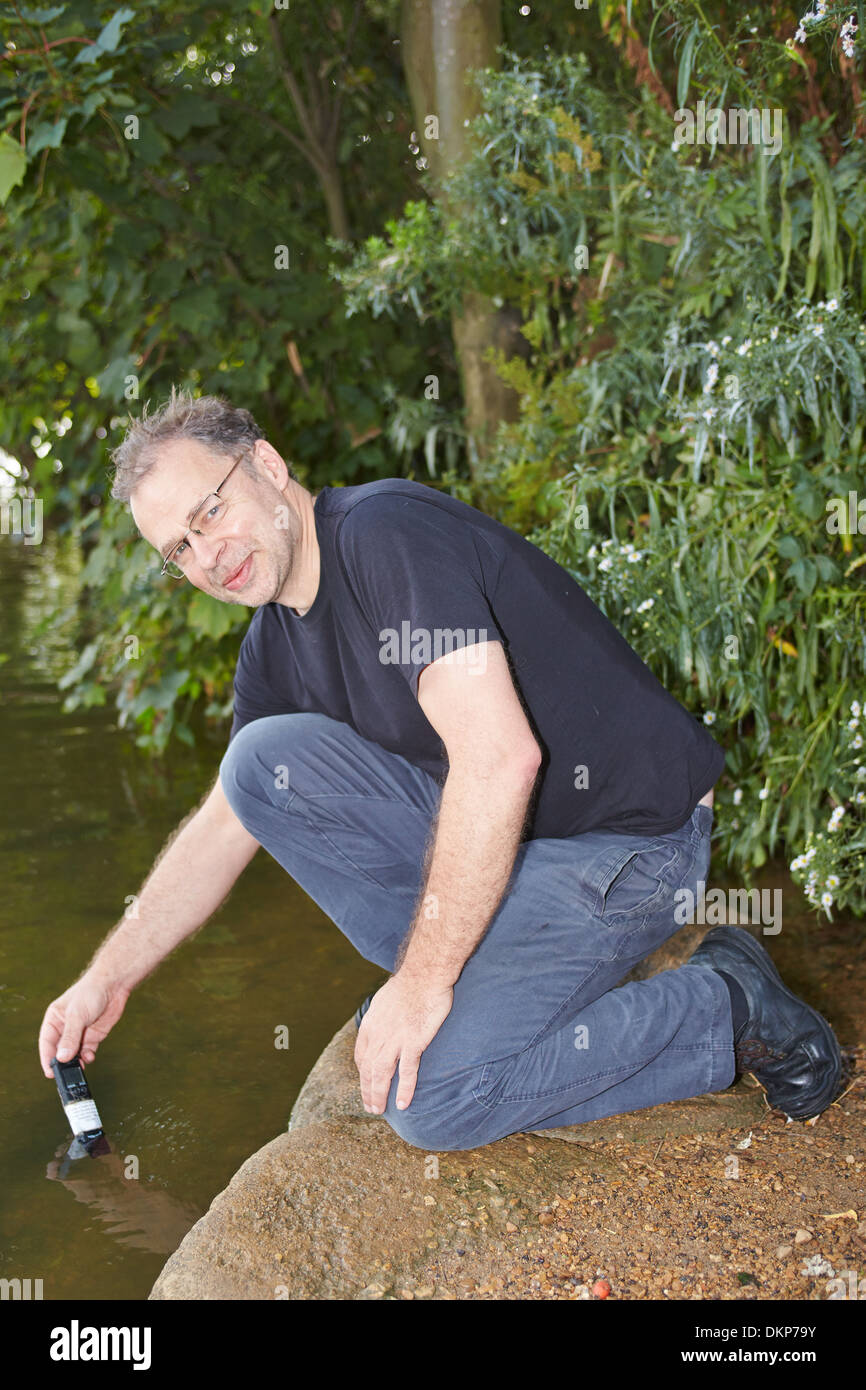Dr Jeremy Biggs, director of the Freshwater Habitats Trust, tests the ...