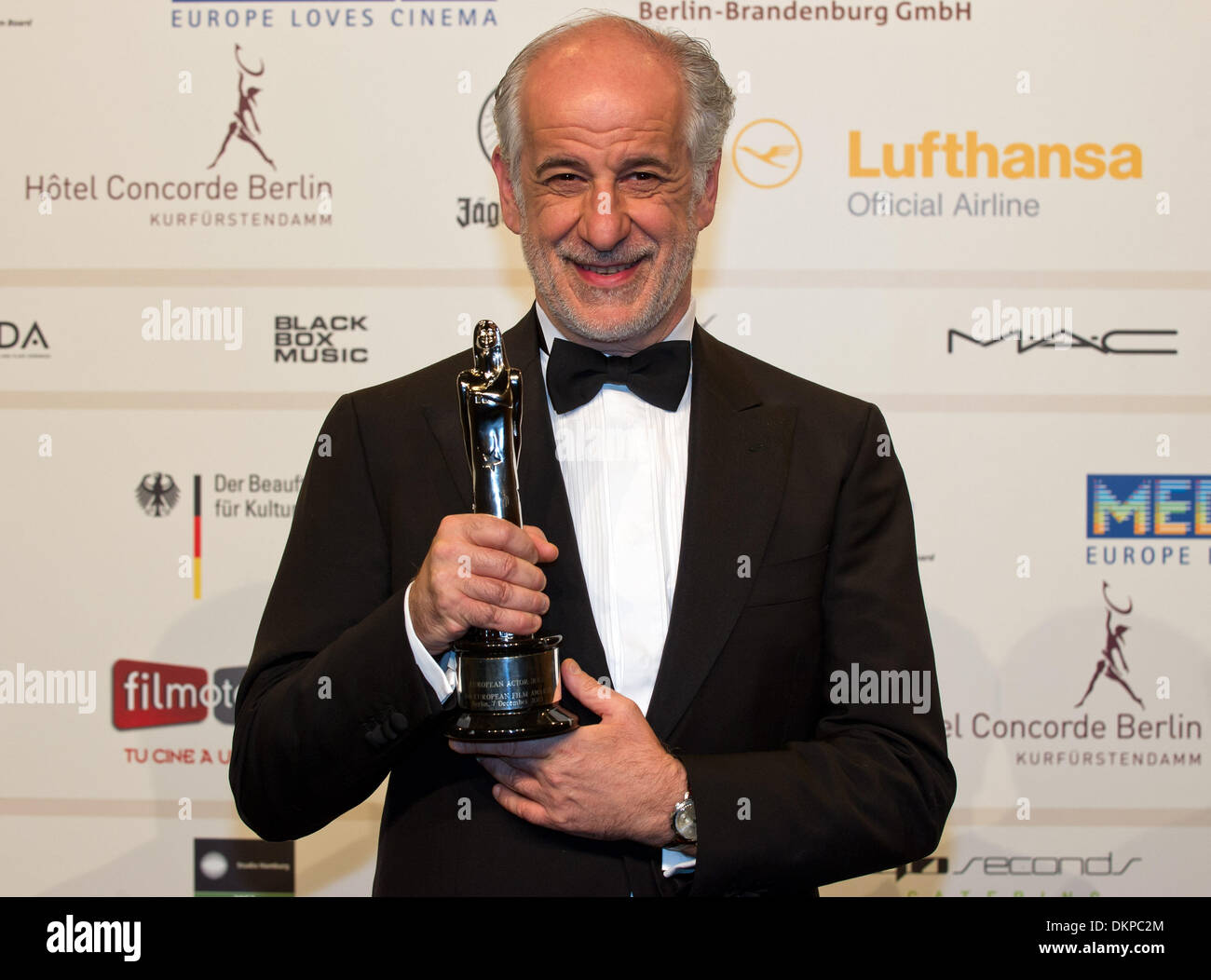Berlin, Germany. 07th Dec, 2013. Italian actor Toni Servillo poses with ...