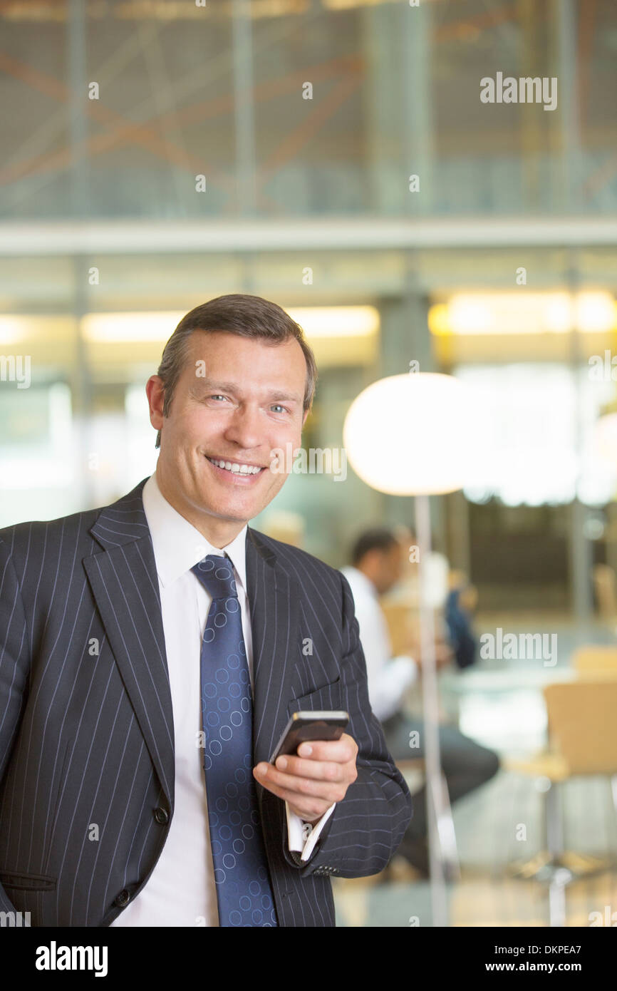 Portrait businessman cellphone office hi-res stock photography and ...