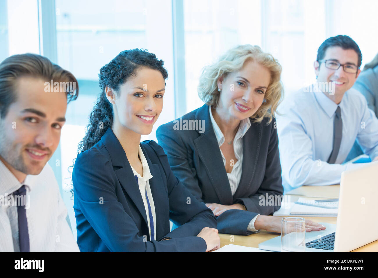 Business people smiling in meeting Stock Photo - Alamy