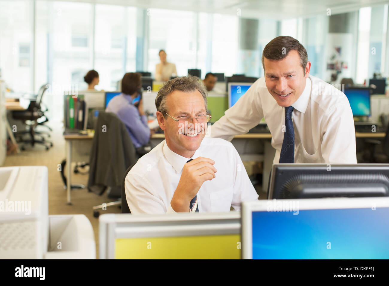 Businessmen working in office Stock Photo - Alamy
