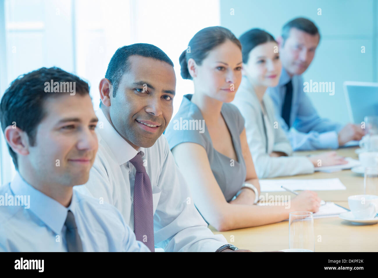 Business people smiling in meeting Stock Photo - Alamy