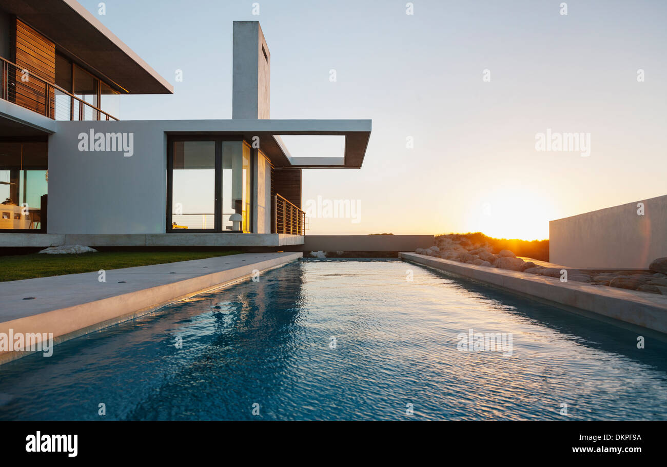 Lap pool outside modern house at sunset Stock Photo - Alamy
