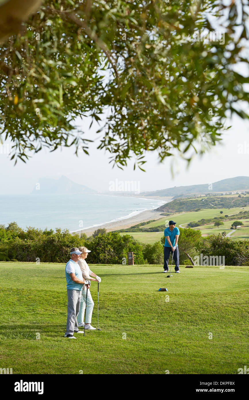 Senior woman playing golf holding club hi-res stock photography and ...