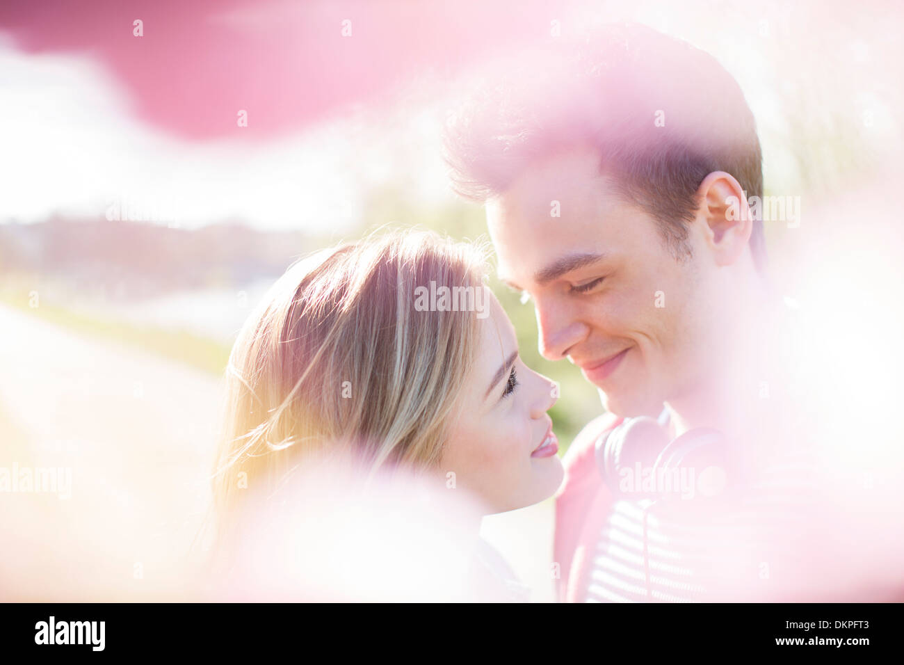 Couple smiling together outdoors Stock Photo - Alamy