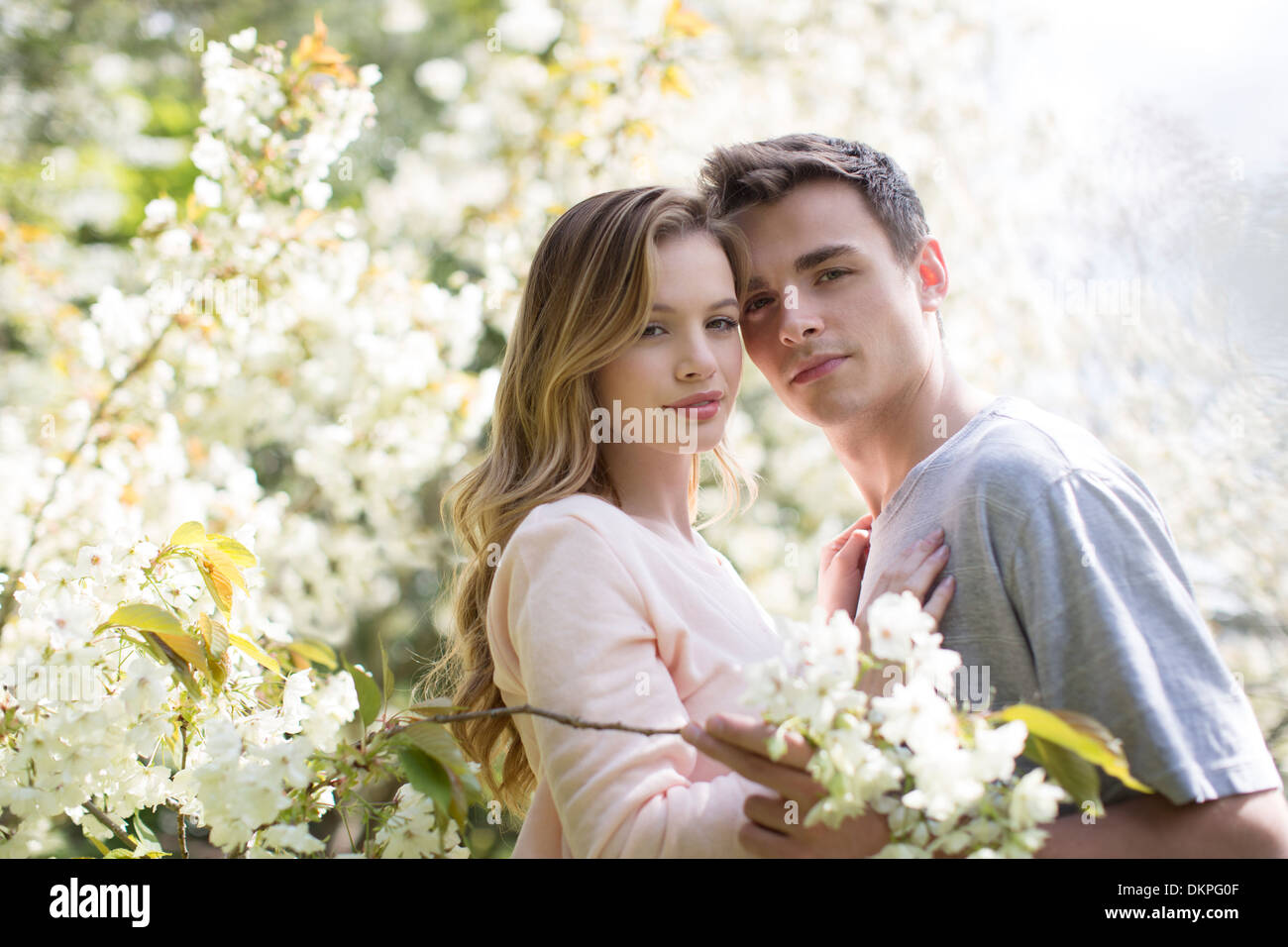 Couple underneath tree hi-res stock photography and images - Alamy