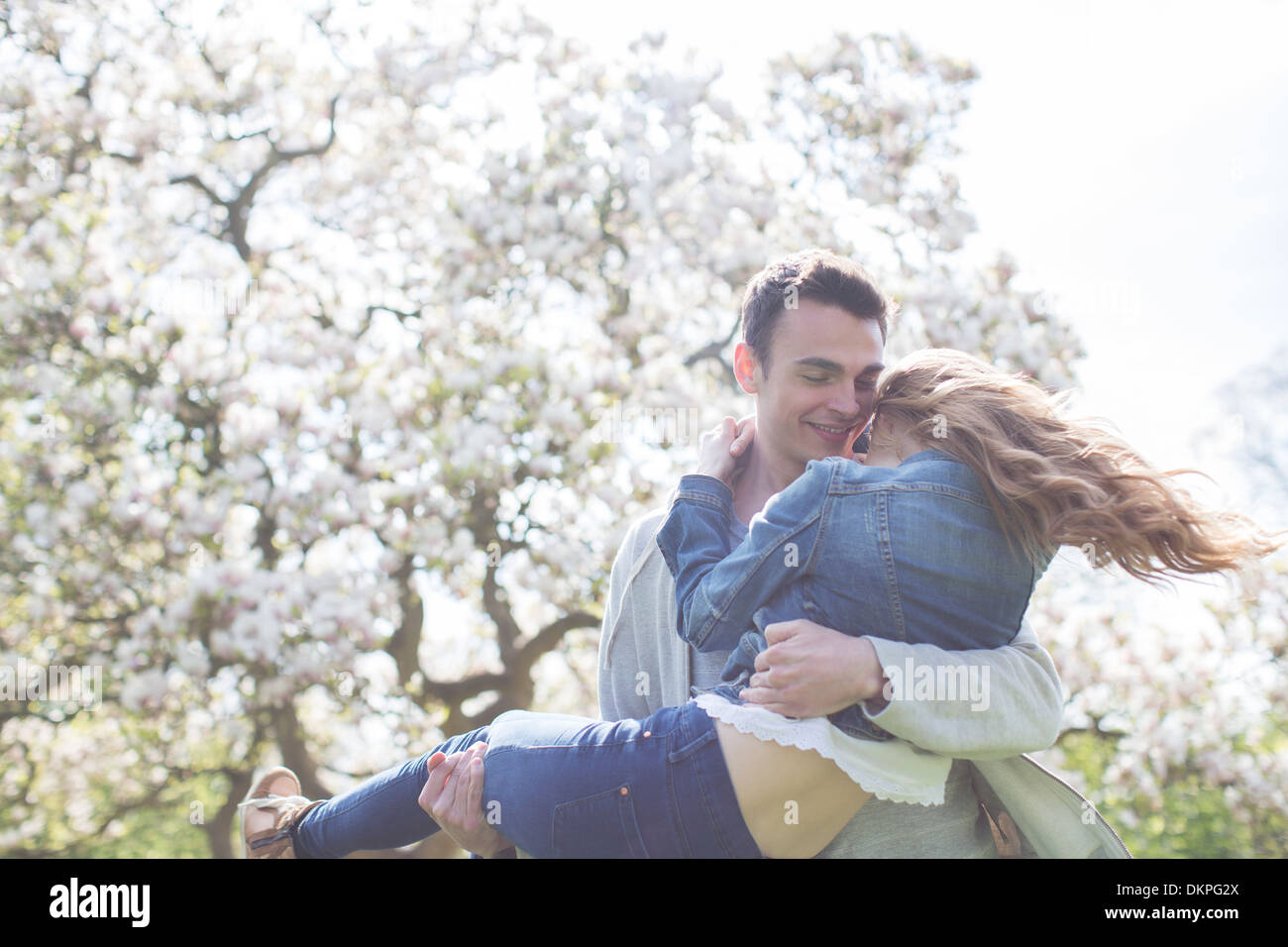 Man lifting woman up hi-res stock photography and images - Alamy