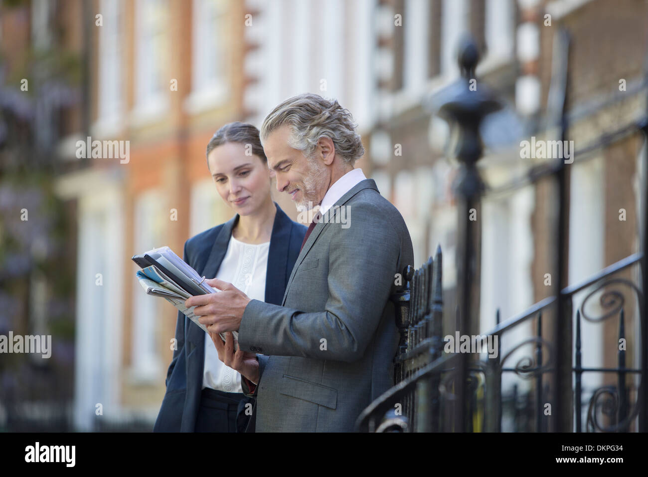 Business people talking outdoors Stock Photo - Alamy