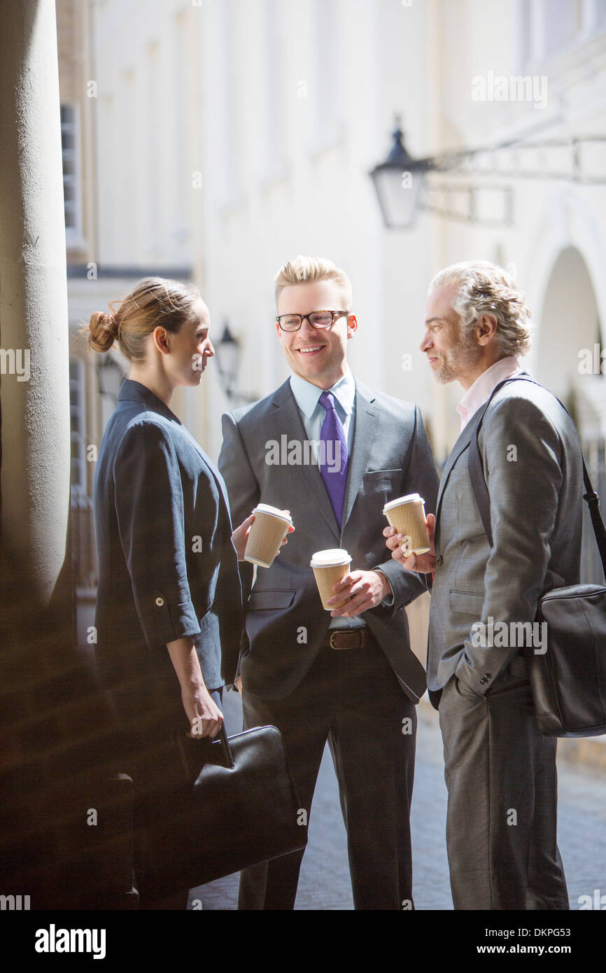 3 people talking hi-res stock photography and images - Alamy