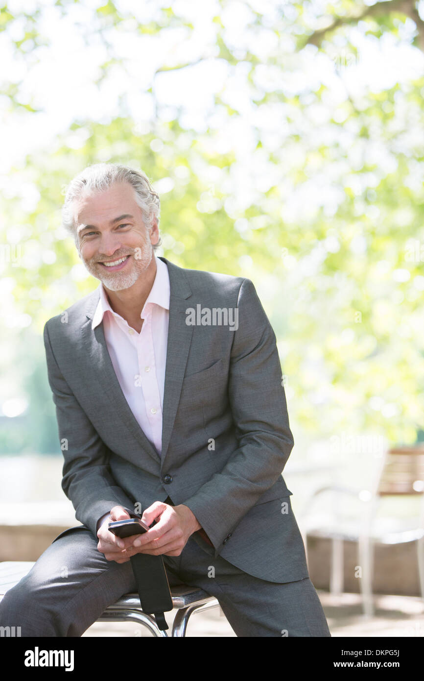 Smiling businessman cell hi-res stock photography and images - Alamy