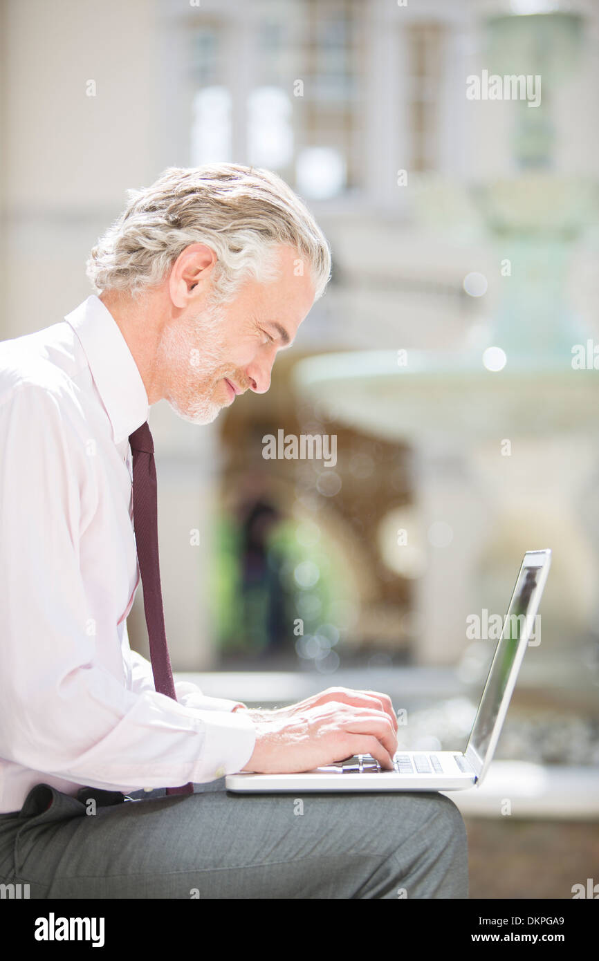 Businessman typing laptop outside hi-res stock photography and images ...
