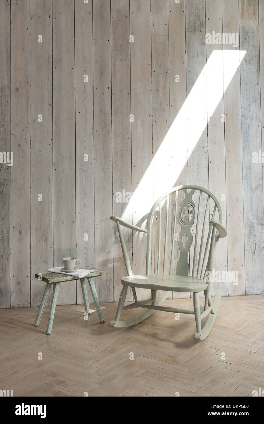 Rocking chair and side table Stock Photo - Alamy