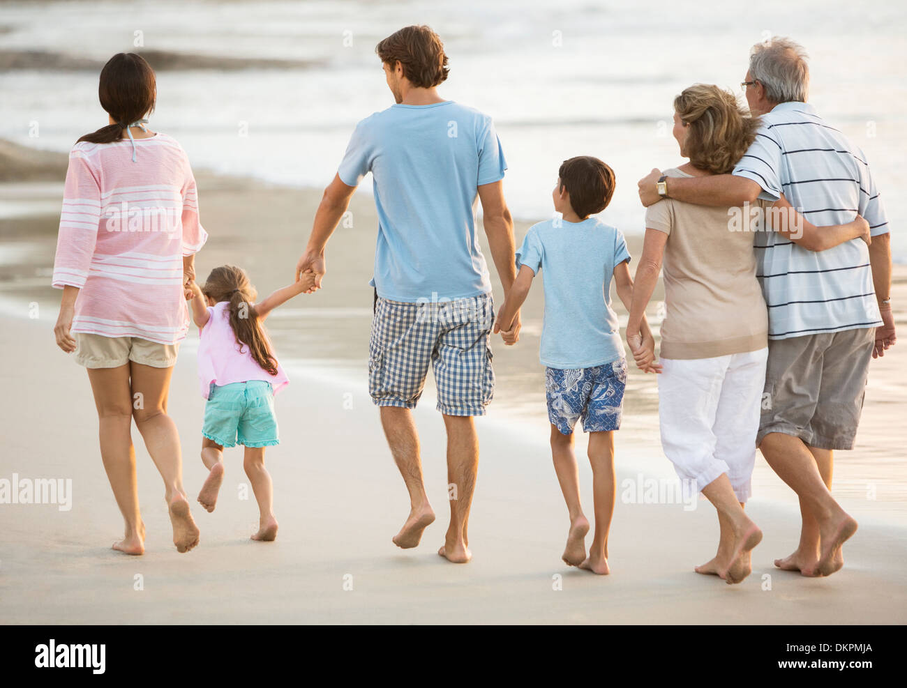 Multi generation family walking on beach hi-res stock photography and ...