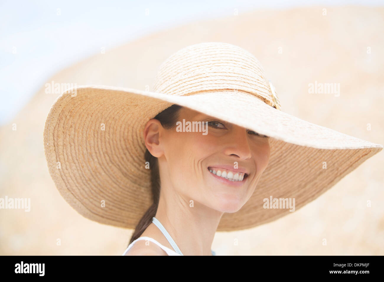 Woman wearing straw hat outdoors Stock Photo - Alamy