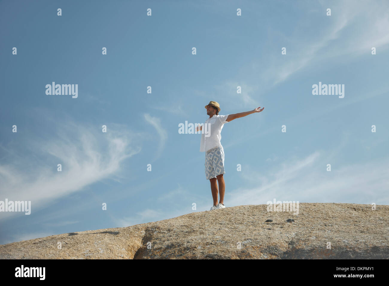 Man standing on stone rock hi-res stock photography and images - Alamy