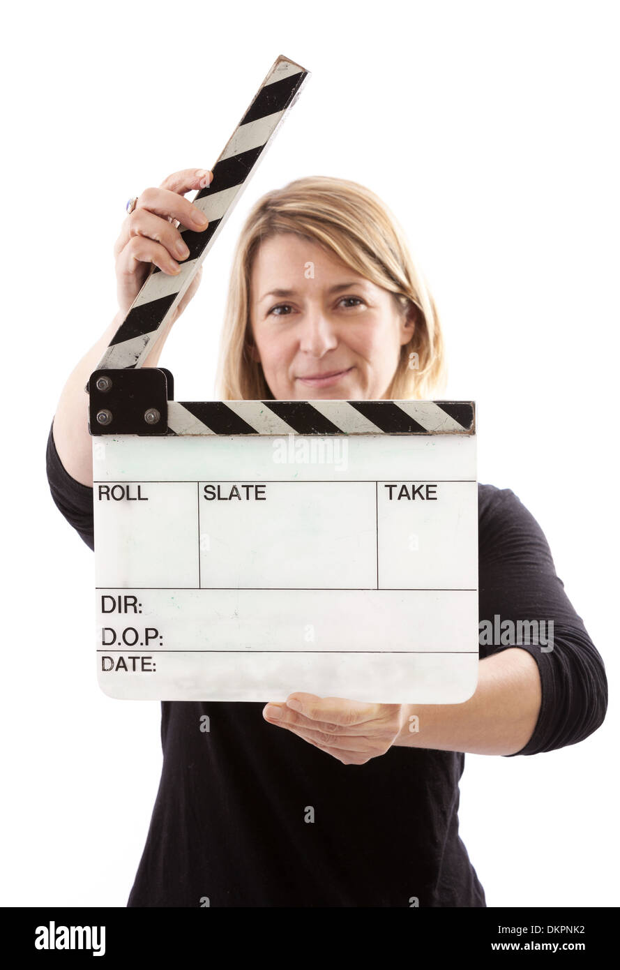 Woman holding an open film clapperboard on a white background ...