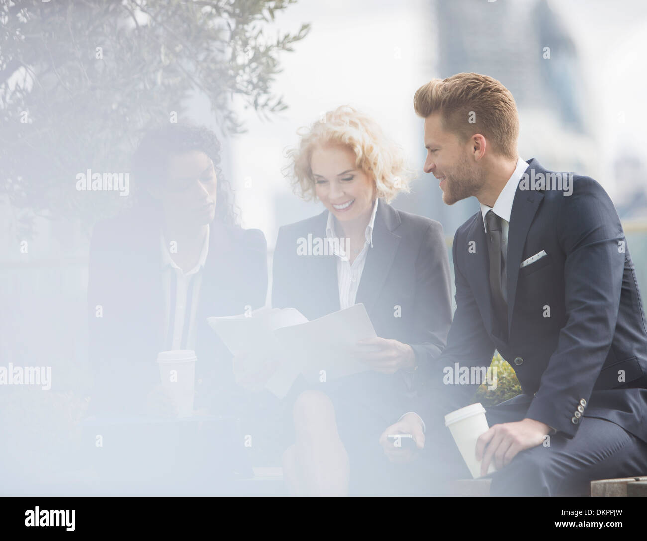 Business people talking outdoors Stock Photo - Alamy