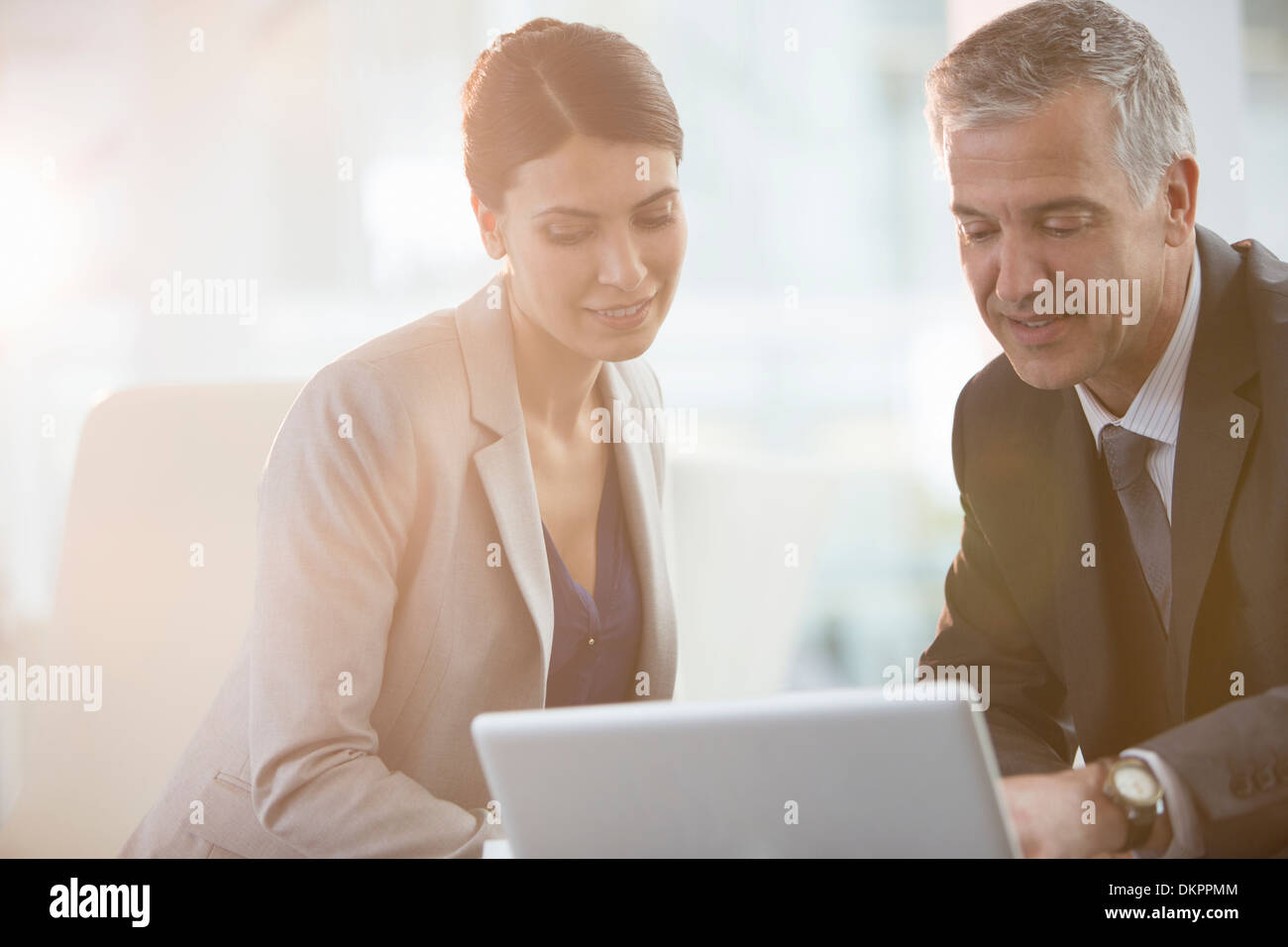 Business people using laptop in office Stock Photo - Alamy