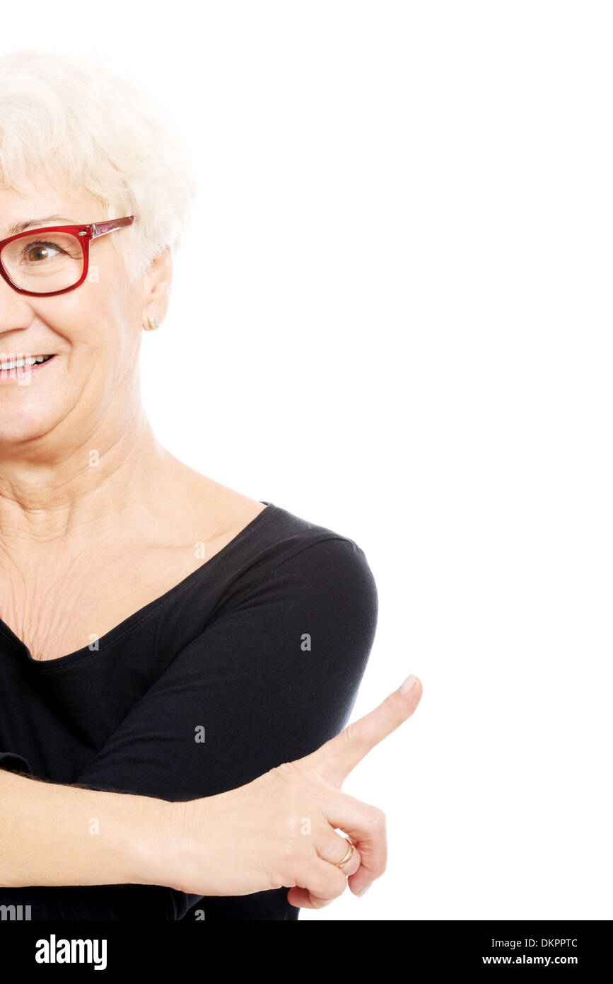 An old lady pointing on copy space. Cut out. Isolated on white Stock ...