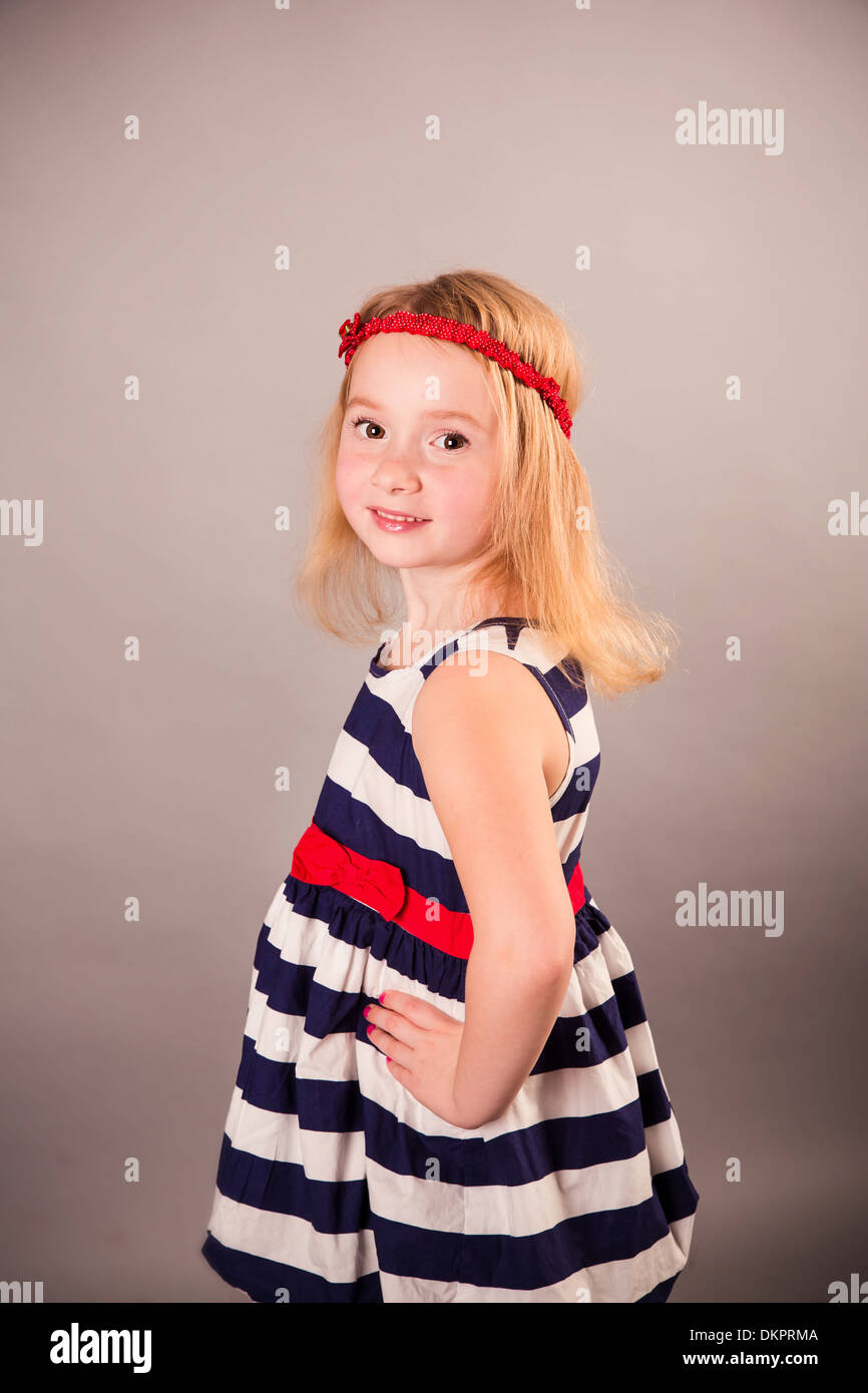 Beautiful girl in a dress posing Stock Photo - Alamy