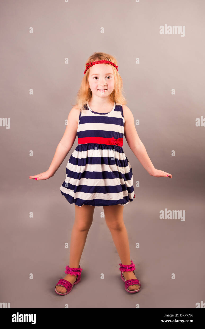 Beautiful girl in a dress posing Stock Photo - Alamy
