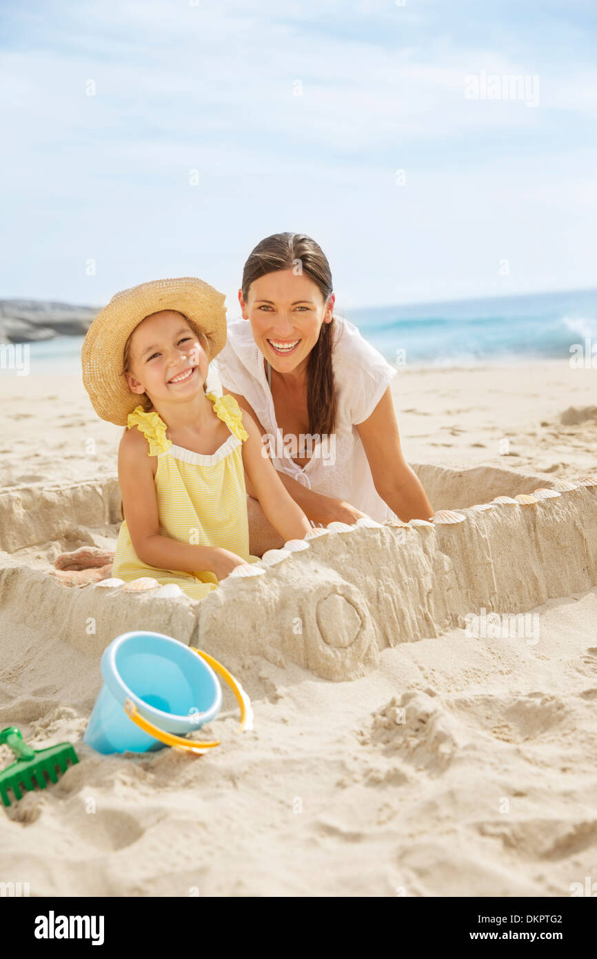 Girl building sandcastle hi-res stock photography and images - Alamy