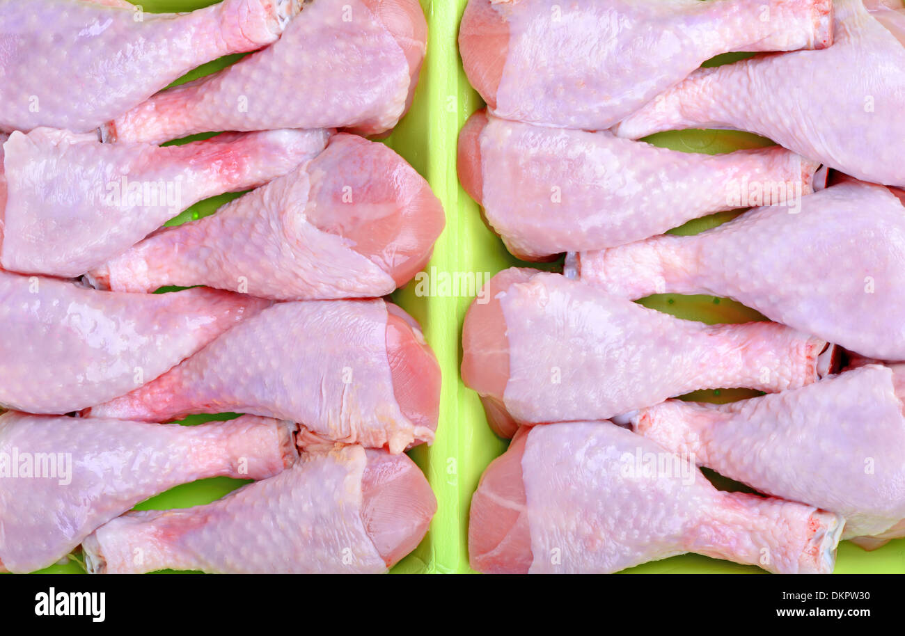 Fresh chicken legs on the retail tray. Isolated on a white Stock Photo ...