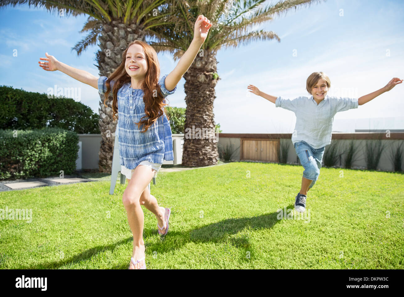 Children playing in backyard Stock Photo - Alamy