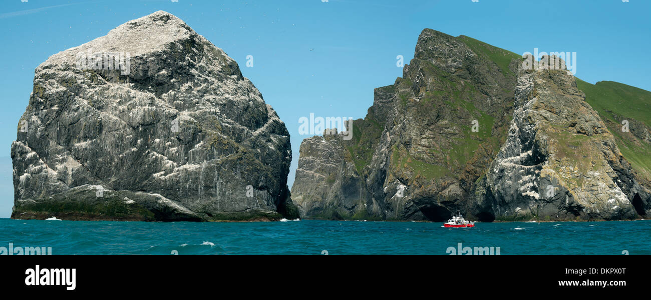 Tourist boat below Stac Lee, St Kilda archipelago, Outer Hebrides ...