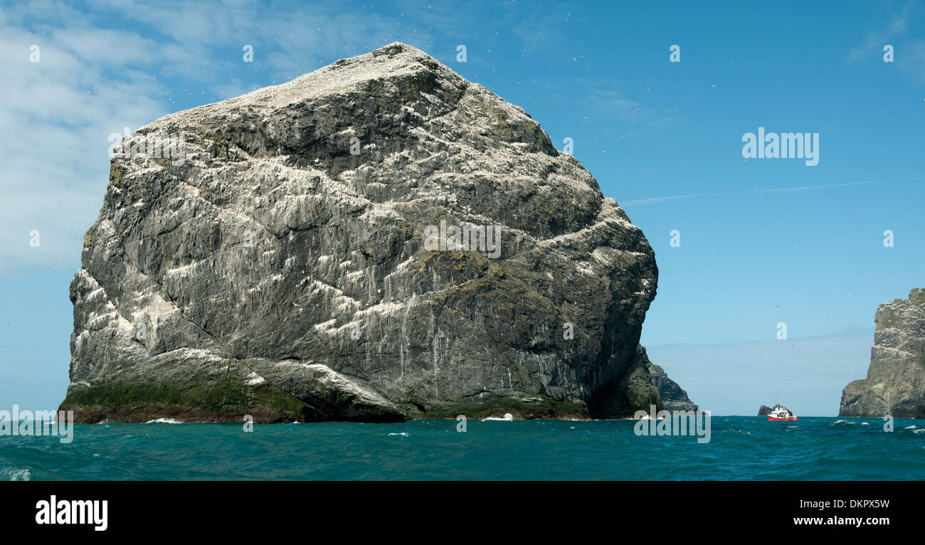 Tourist boat below Stac Lee, St Kilda archipelago, Outer Hebrides ...