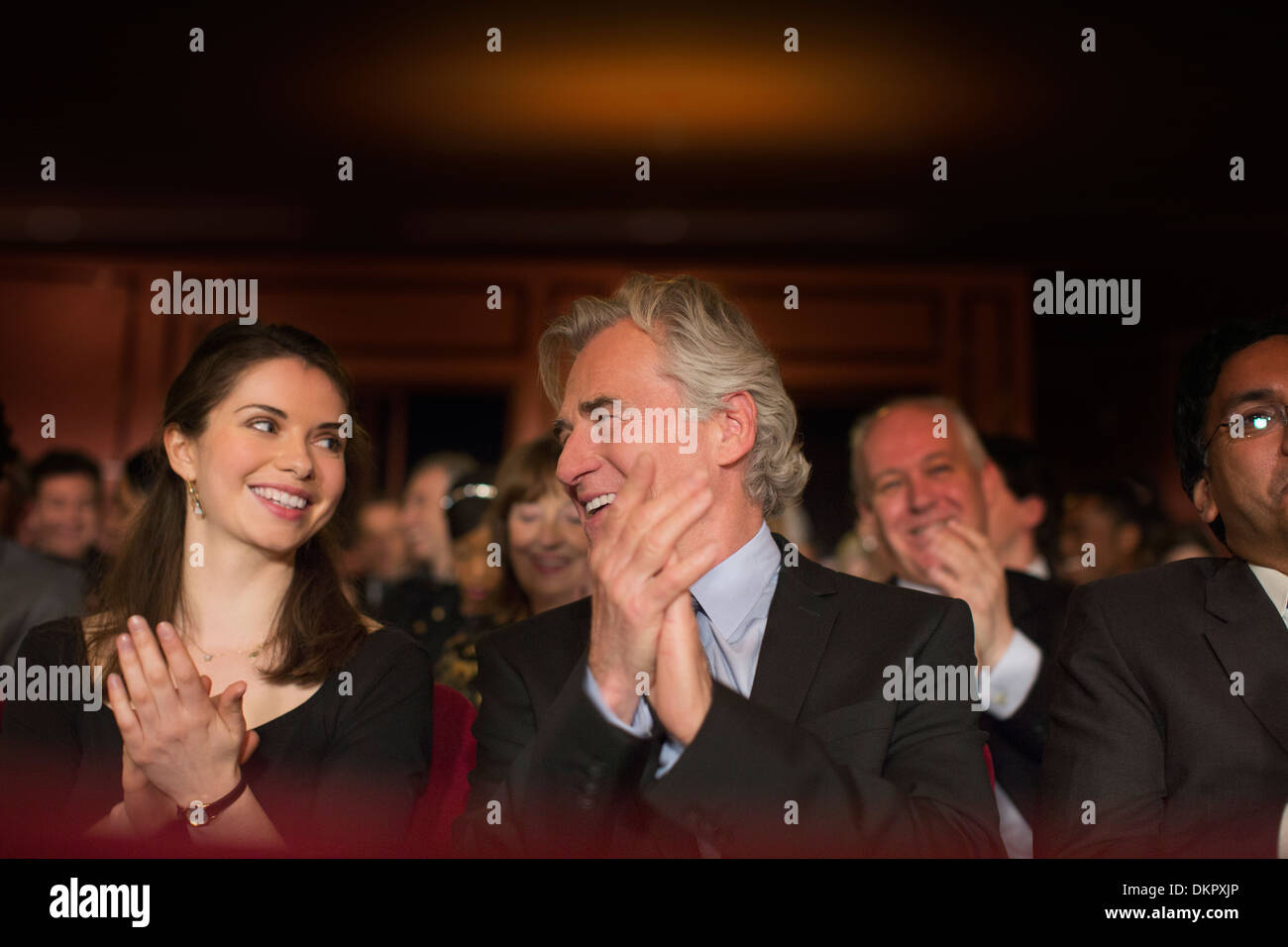Clapping theater audience Stock Photo - Alamy