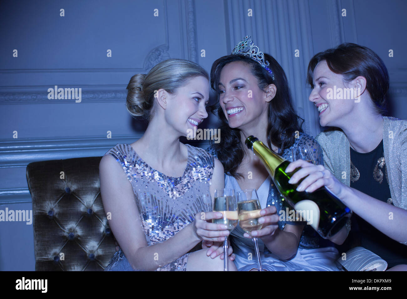 Well dressed women drinking champagne in luxury nightclub Stock Photo ...