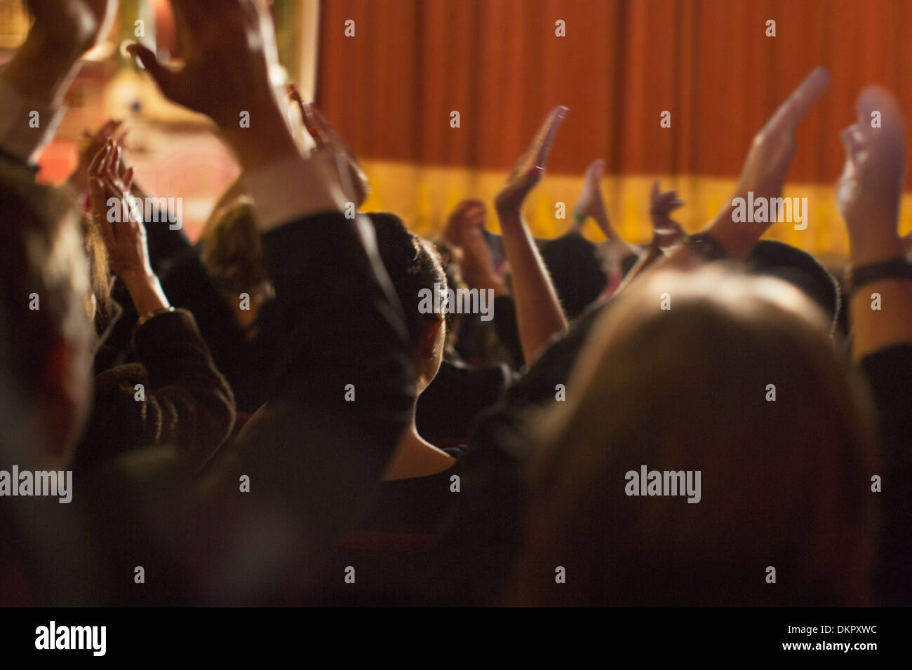 Rear view of clapping theater audience Stock Photo - Alamy