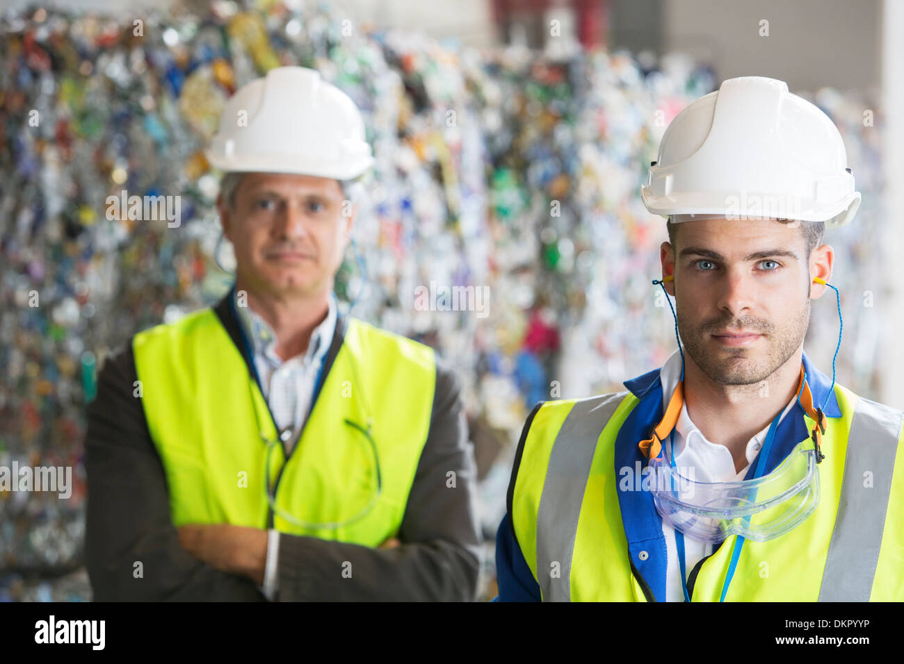 Serious workers in recycling center Stock Photo - Alamy
