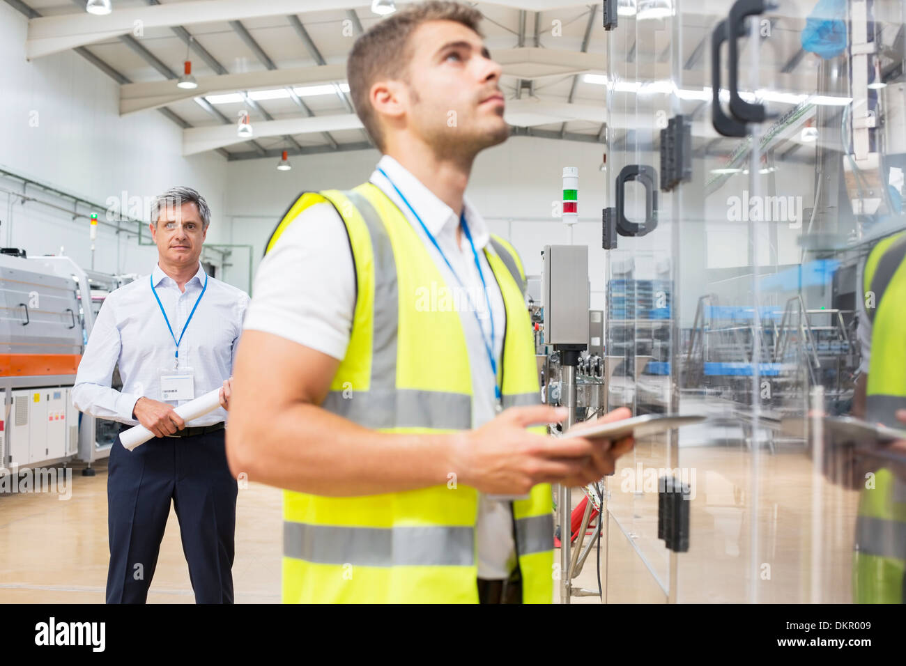 Mature supervisor holding digital hi-res stock photography and images ...