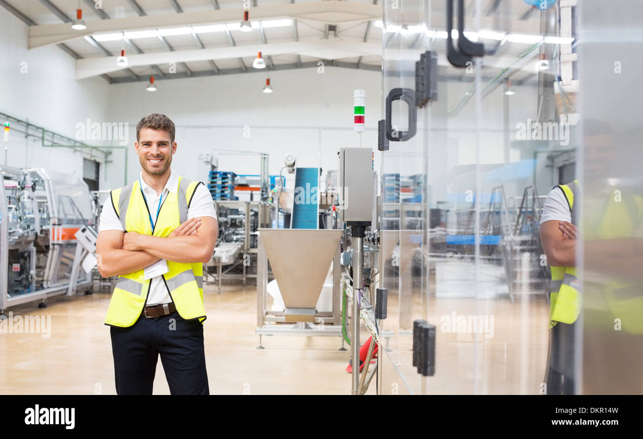 Male factory worker smiling hi-res stock photography and images - Alamy