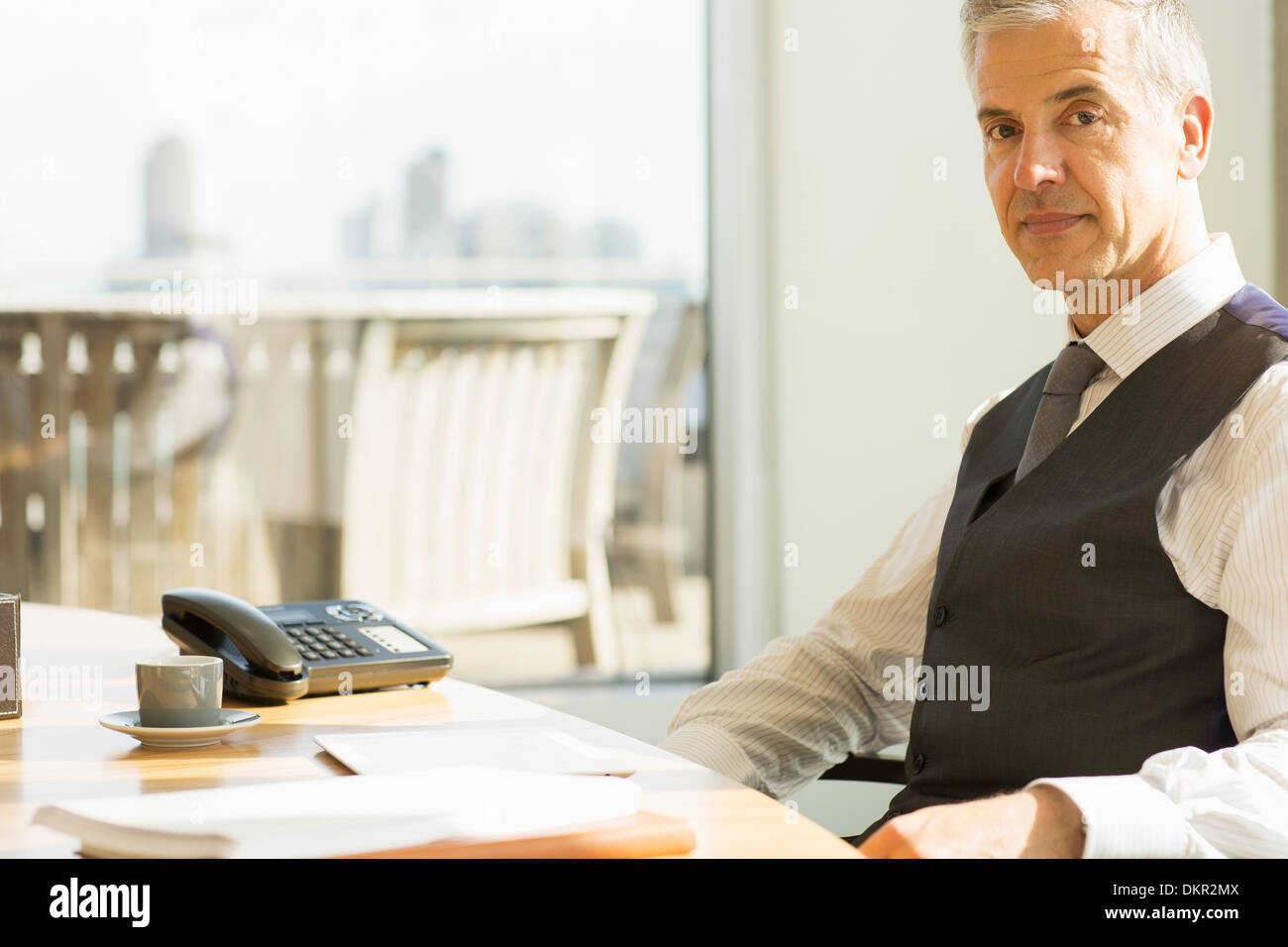 Confident caucasian man sitting desk hi-res stock photography and ...