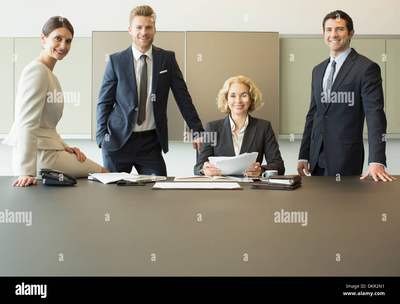 Business people smiling in meeting Stock Photo - Alamy