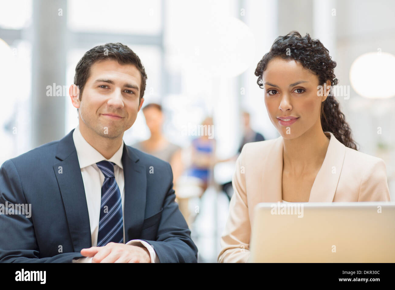 Business people smiling in office Stock Photo - Alamy