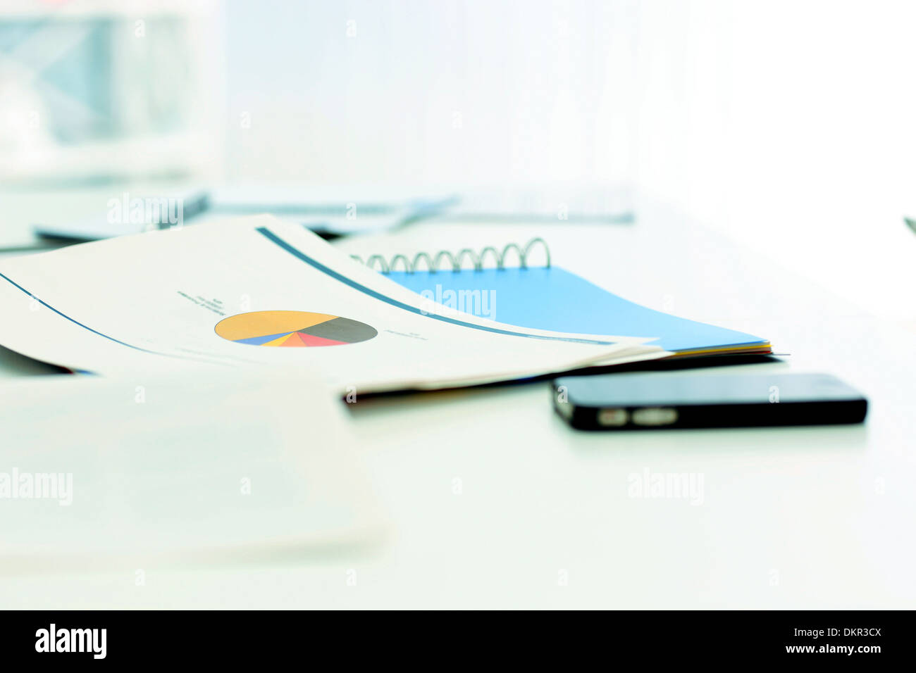 Closeup image of a table full of documents Stock Photo - Alamy