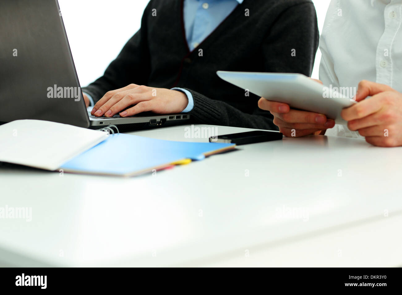 Businesspeople working in office at the table Stock Photo - Alamy