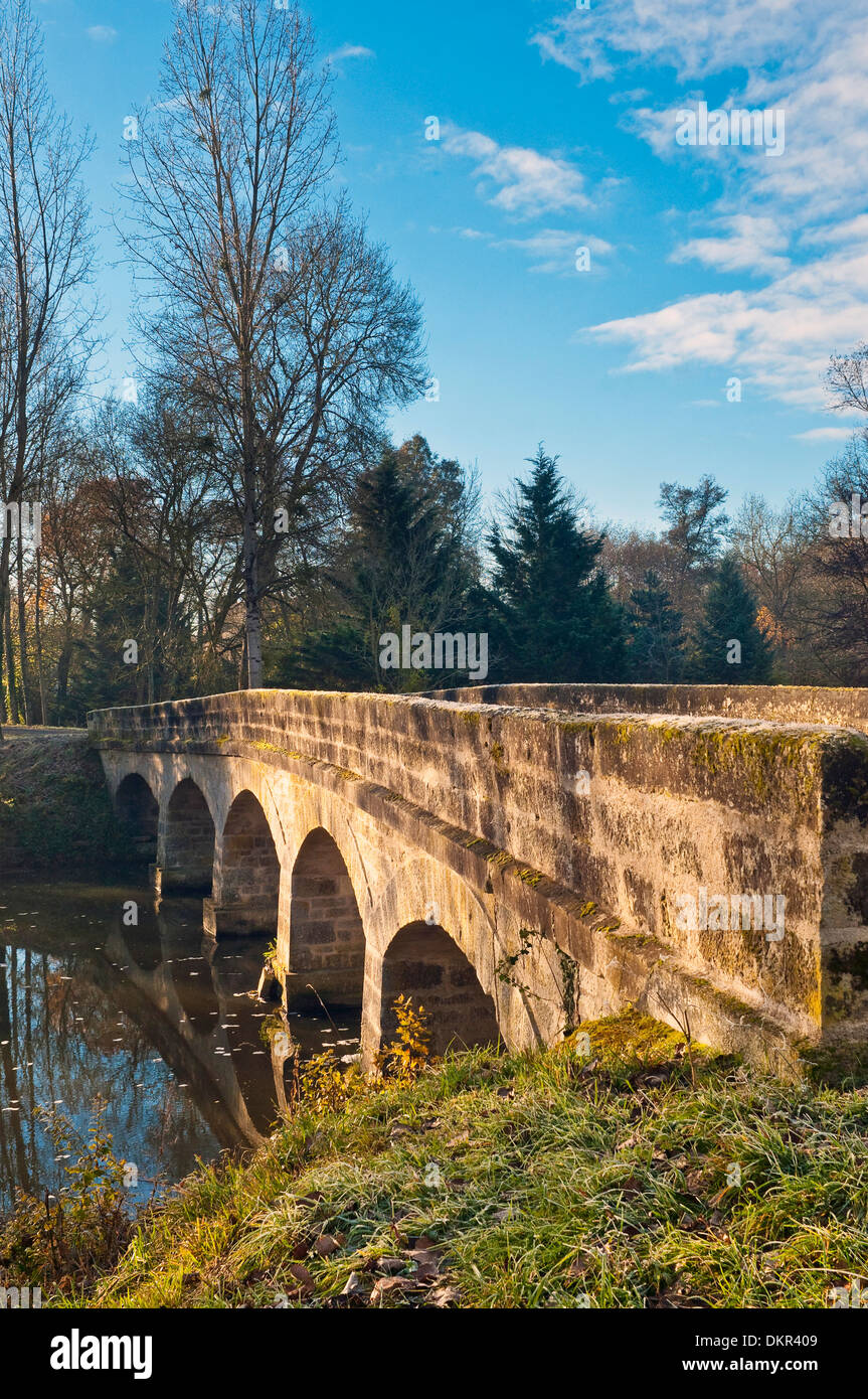Old stone arched bridge across river - Indre-et-Loire, France Stock ...