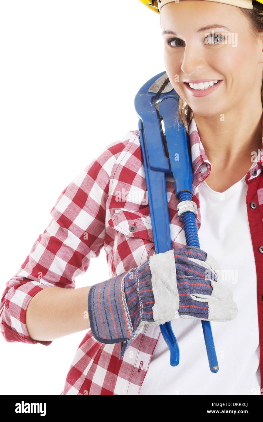 Casual woman in safety helmet and plumber wrench. Isolated on white ...