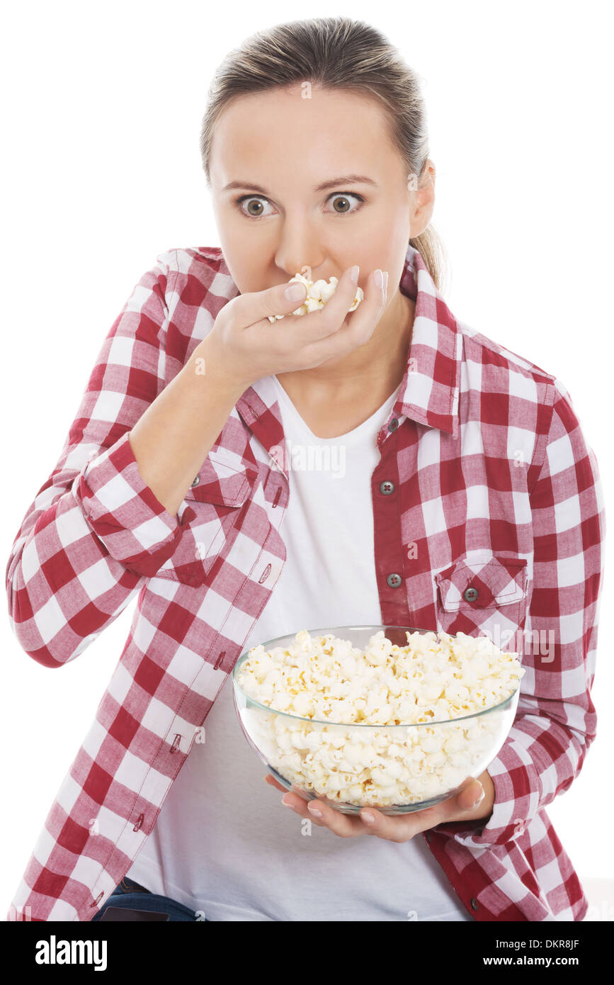Young casual woman eating popcorn. isolated on white Stock Photo - Alamy
