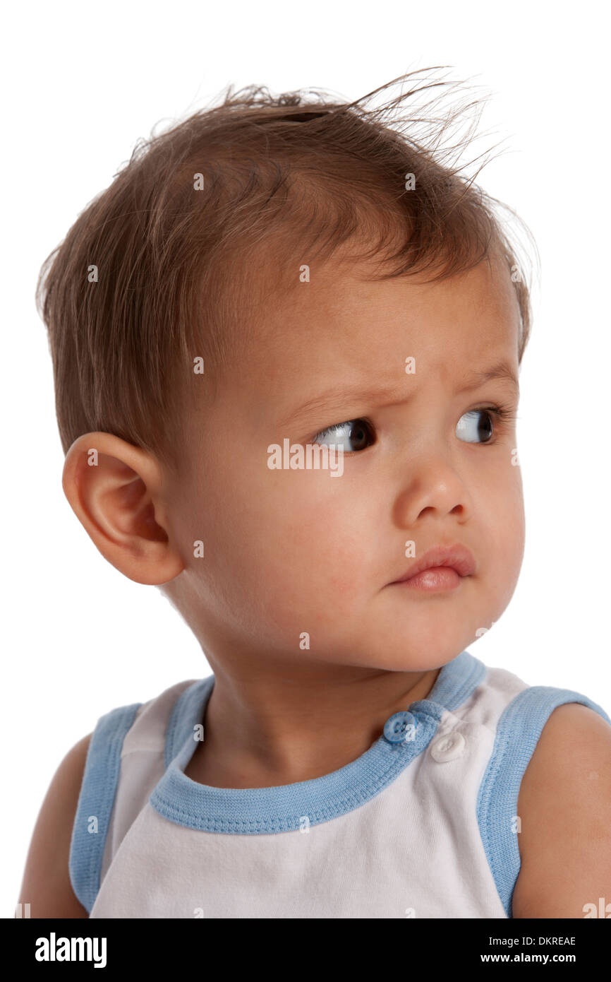 Angry looking toddler boy on white background Stock Photo - Alamy