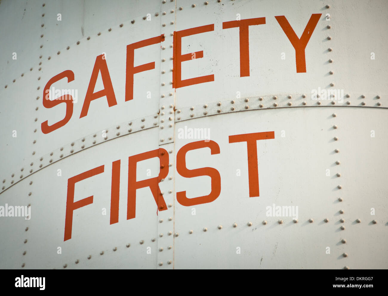 A Metal work sign painted with the words SAFETY FIRST Stock Photo - Alamy