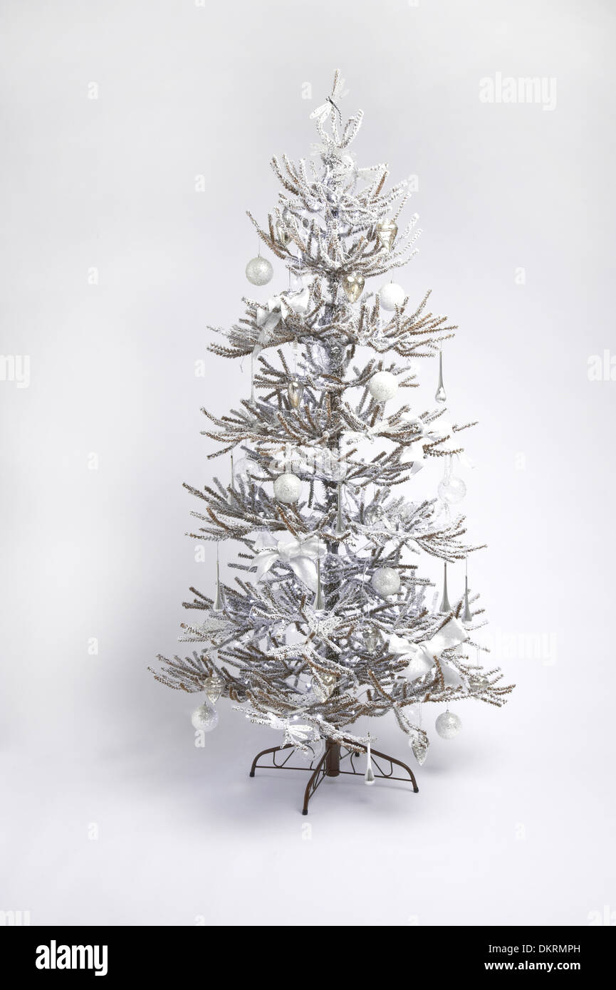 Christmas Tree with snow and decorations Stock Photo - Alamy